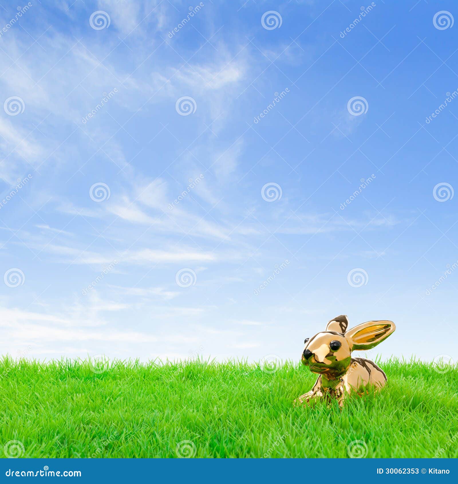 Golden Easter Bunny in a Bright Field Stock Image - Image of ceramic ...
