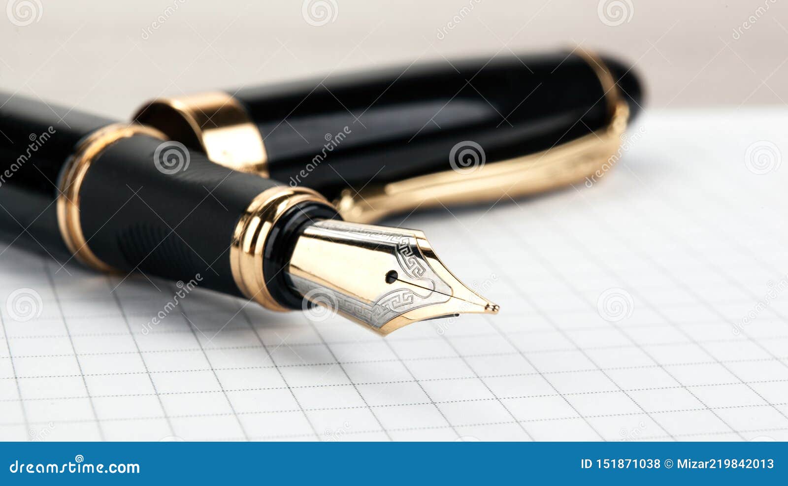 Golden Fountain Pen on the Notepad on a Table Stock Photo - Image of ...