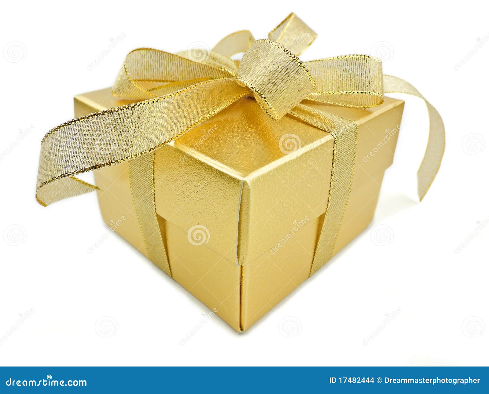 Golden Gift Boxes With Beautiful Ribbon And Bow On A Bright Shiny ...