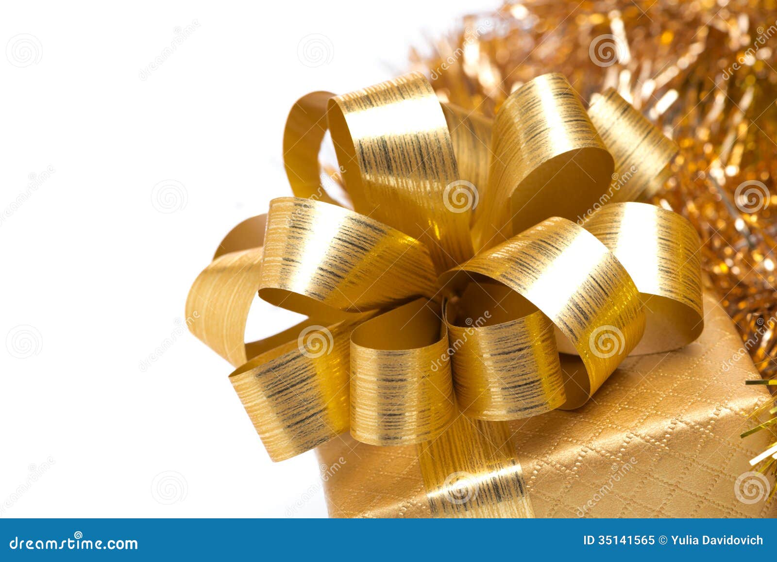 Golden Gift Box and Tinsel, Isolated, Close-up Stock Image - Image of ...