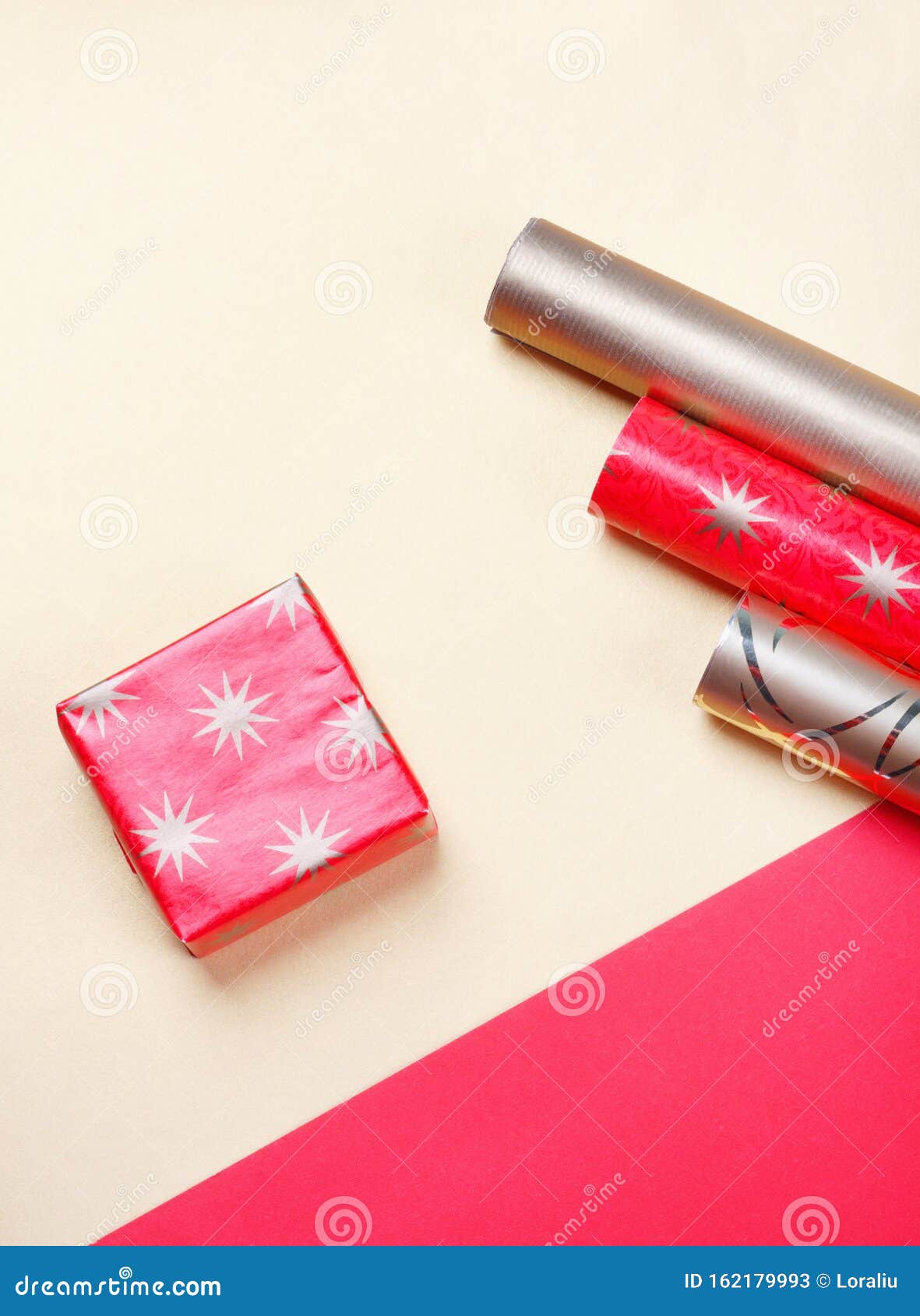 Golden Gift Boxes and Red Wrapping Paper on Bright Background Stock ...