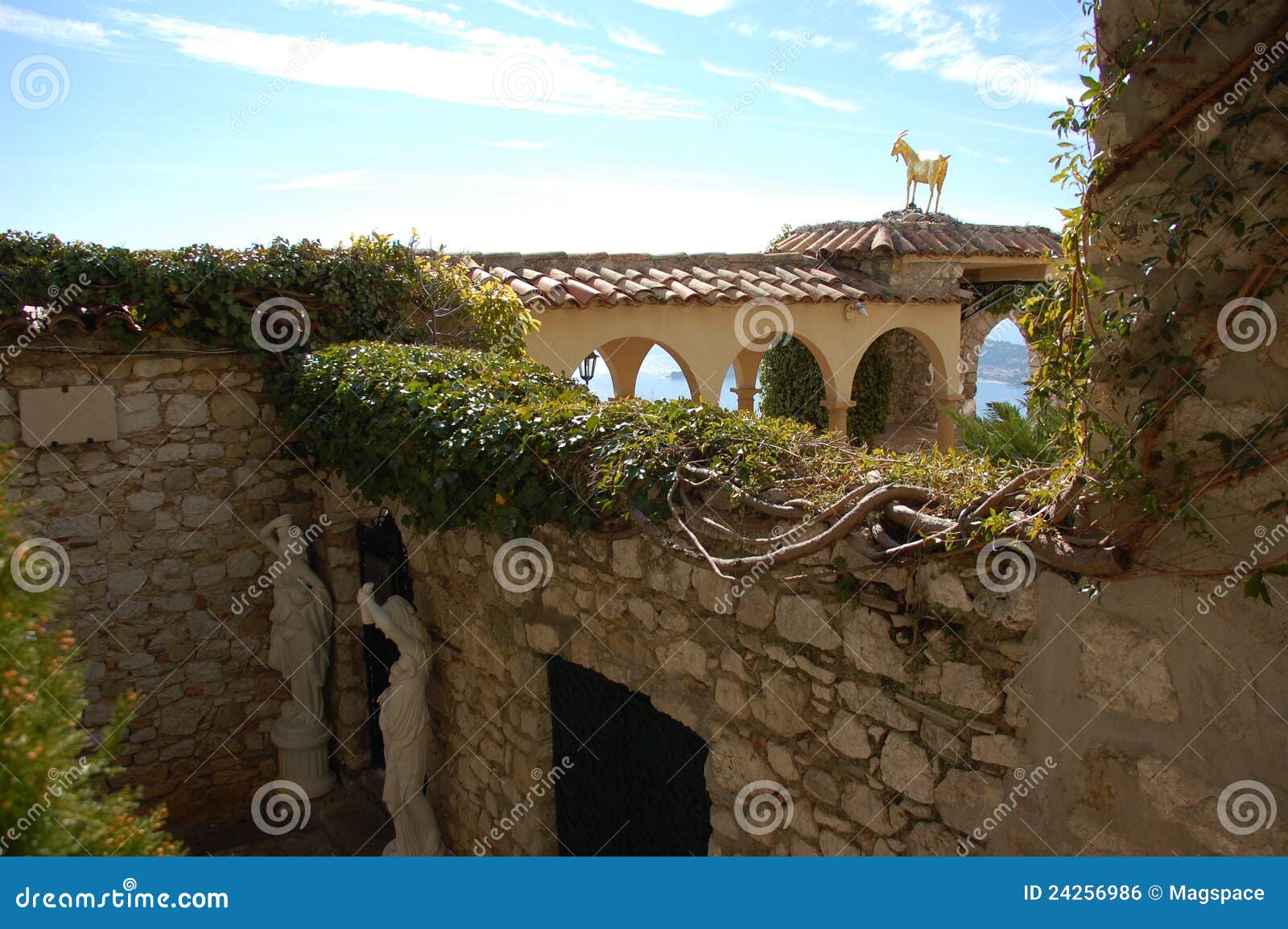 Golden Goat Statue in Eze Village. Stock Photo - Image of plants ...