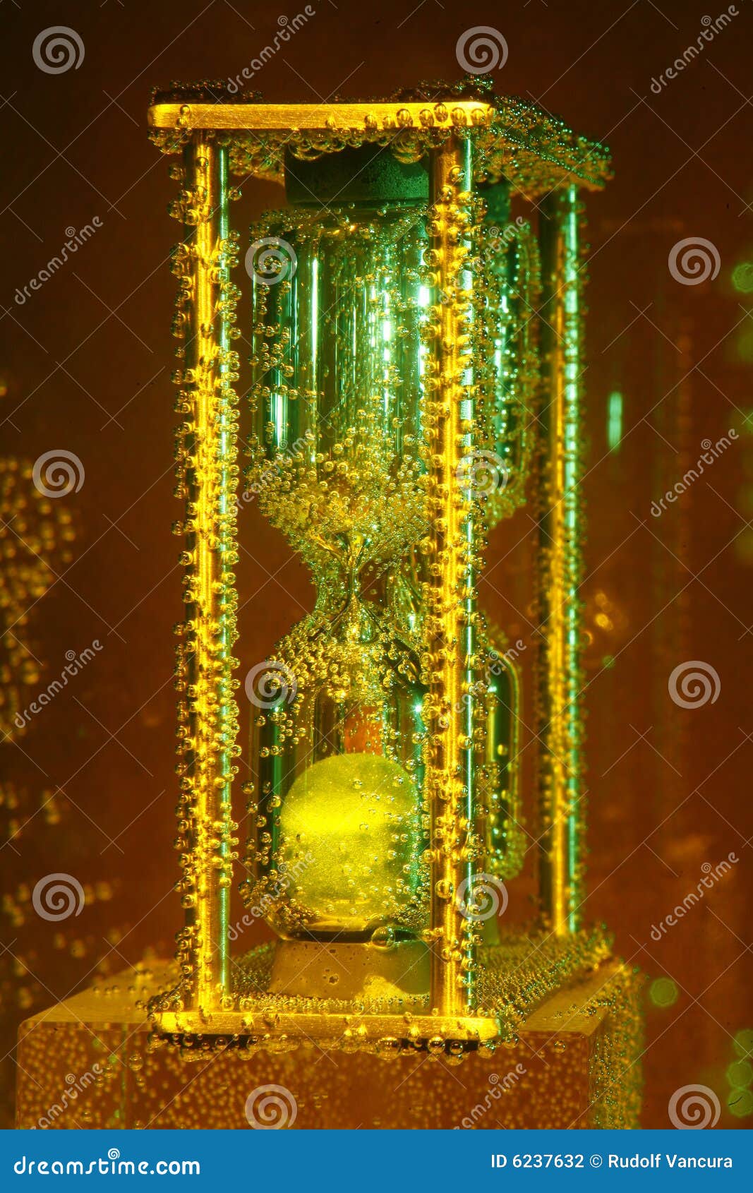Golden hourglass in water stock photo. Image of hour, bubbled - 6237632