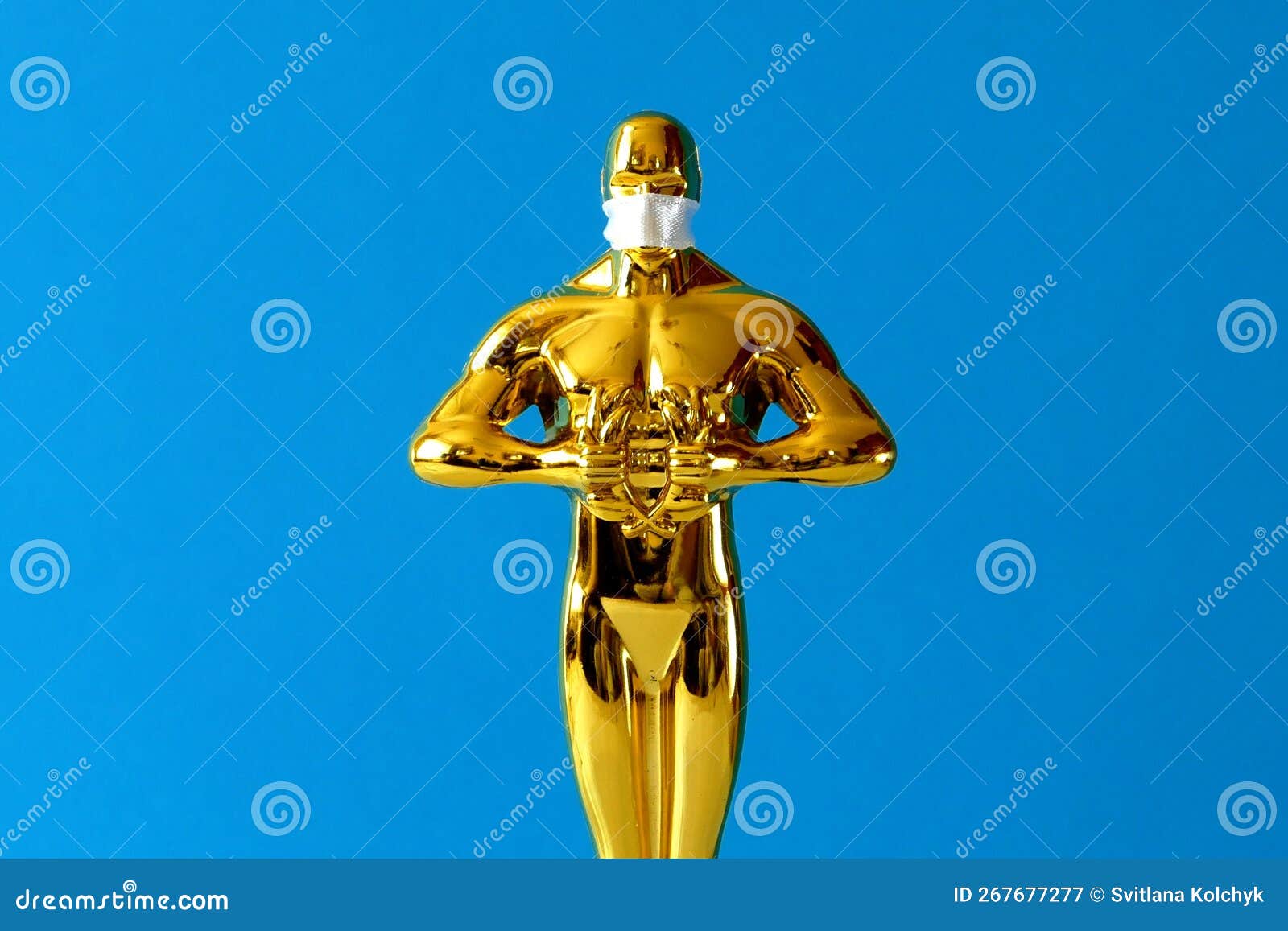 Hollywood Golden Oscar Academy Award Statue in Mask on Blue Background ...