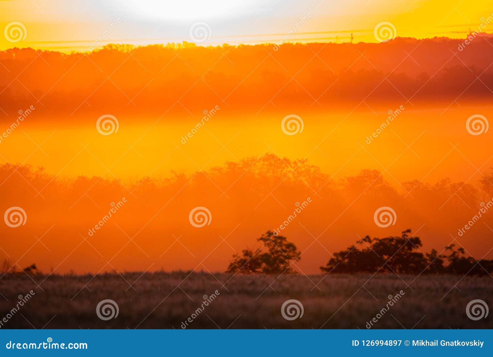 Golden and Orange Sunrise Iluminating a Hills and Fields Stock Image ...