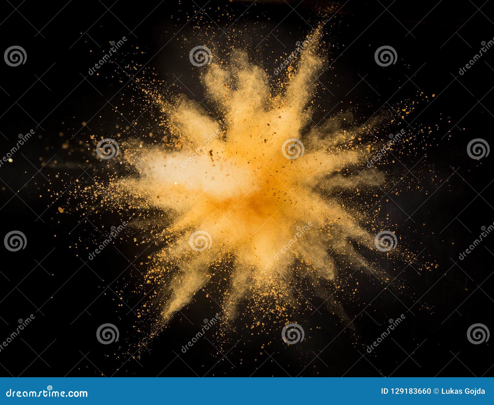 Golden Powder Explosion on Black Background. Stock Photo - Image of ...