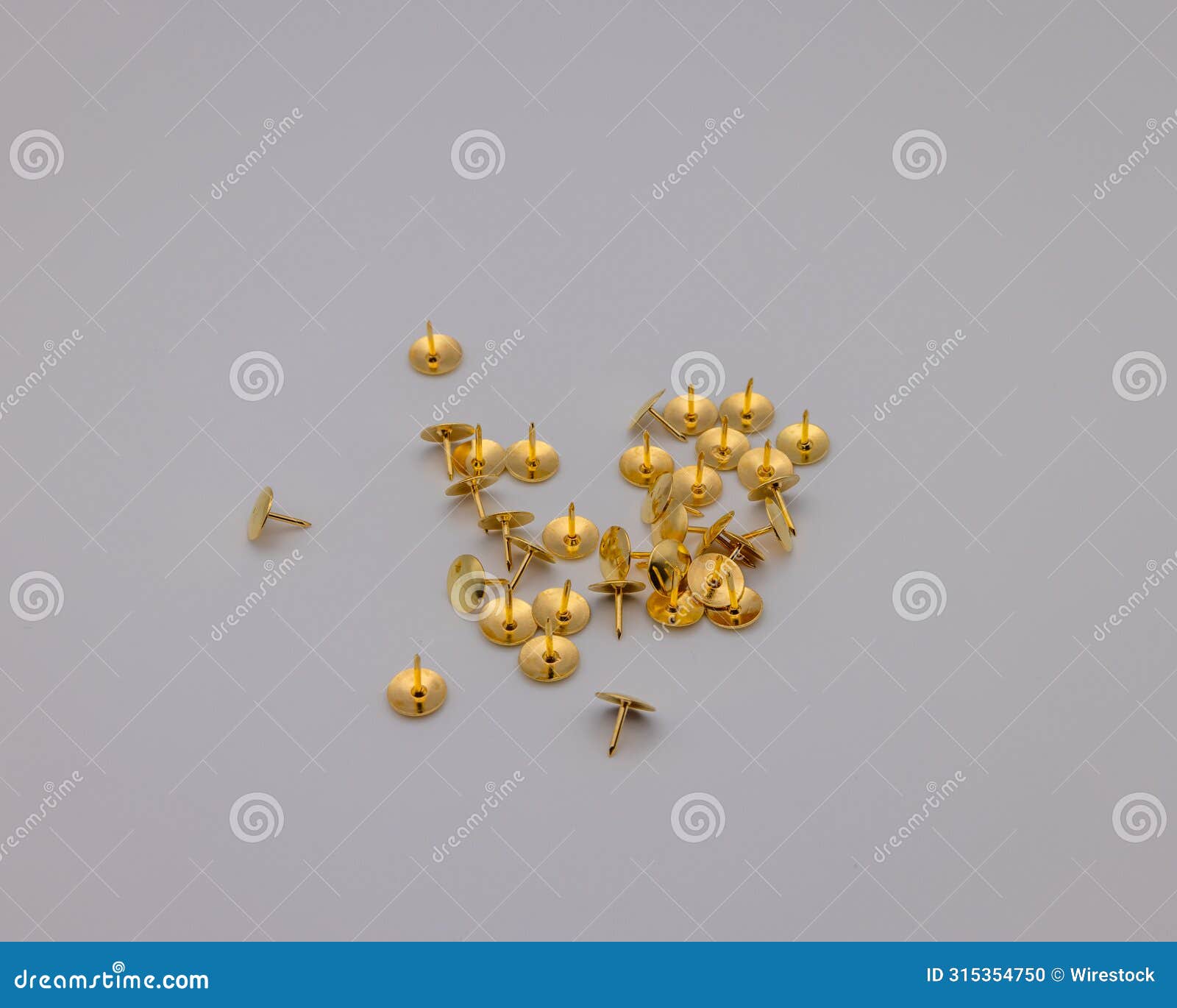 Golden Push Pins on a Grey Surface. Stock Photo - Image of round ...