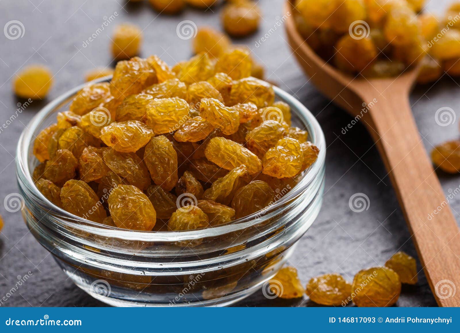 Golden Raisins on a Dark Stone Background Stock Image - Image of ...