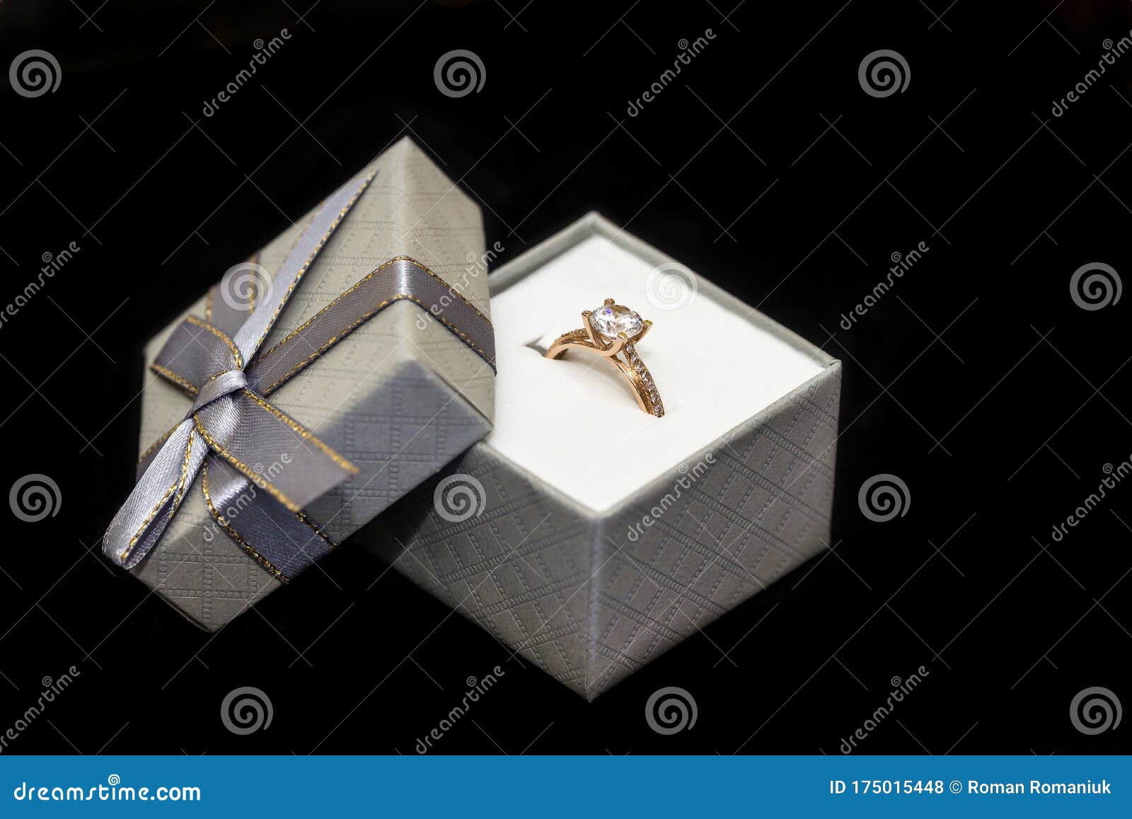 Golden Ring with Diamond in Box Isolated on Black Stock Photo - Image ...
