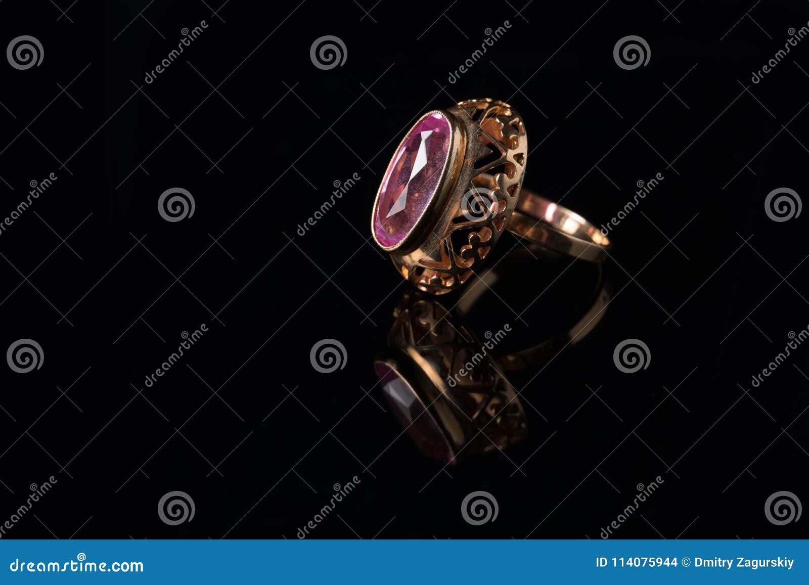 Golden Ring with a Ruby on a Black Background Stock Photo - Image of ...