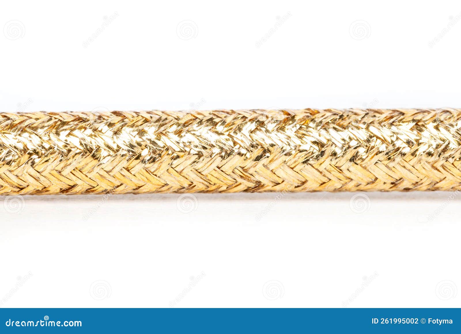 Golden rolled up cord stock photo. Image of twist, line - 261995002