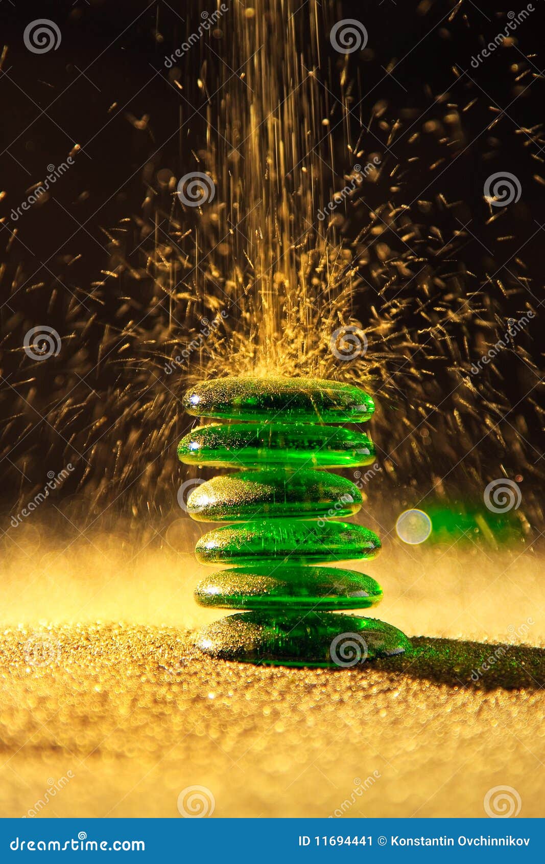 Golden Sand Falling on Balancing Green Stones Stock Image - Image of ...