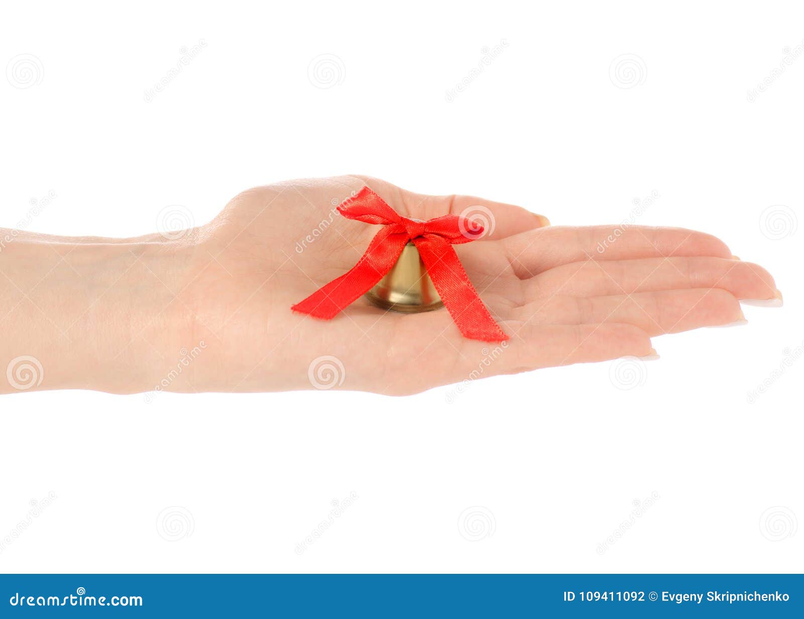 Golden small bell in hand stock photo. Image of icon - 109411092