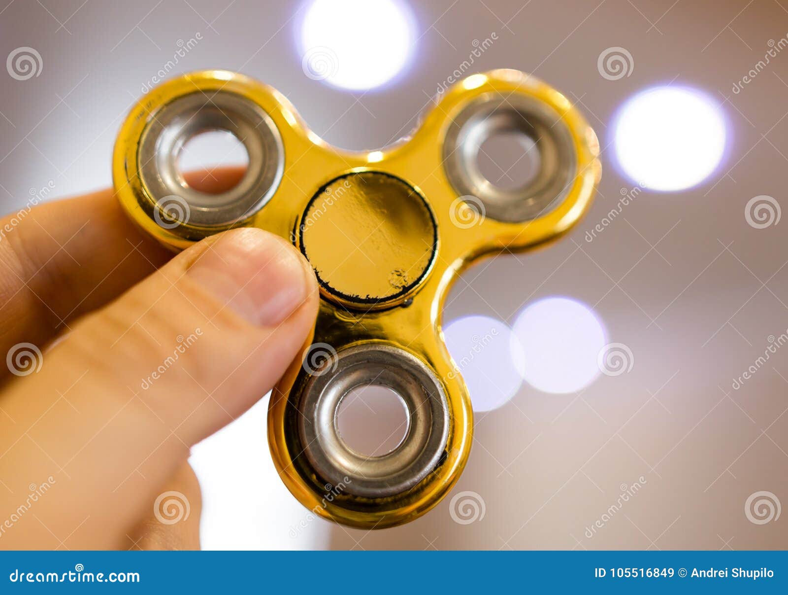 The Golden Spinner is Spinning in His Hand Stock Image - Image of spin ...