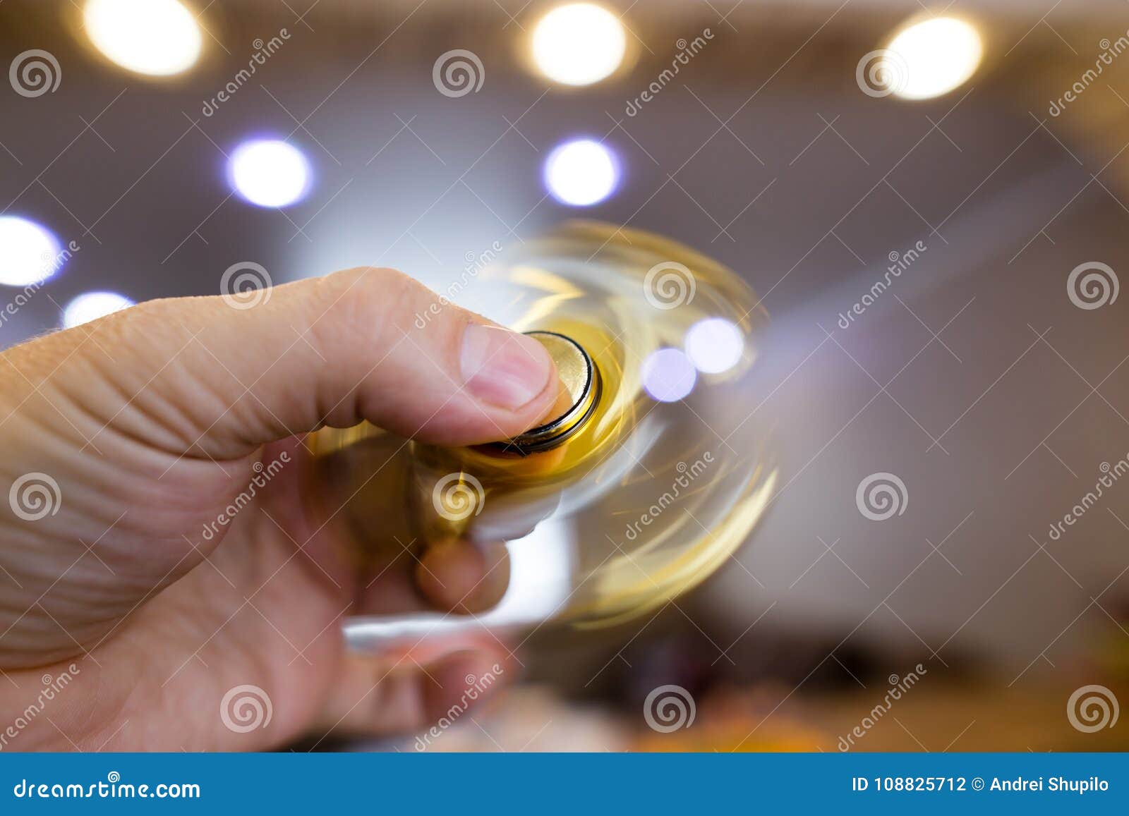 The Golden Spinner is Spinning in His Hand Stock Photo - Image of play ...