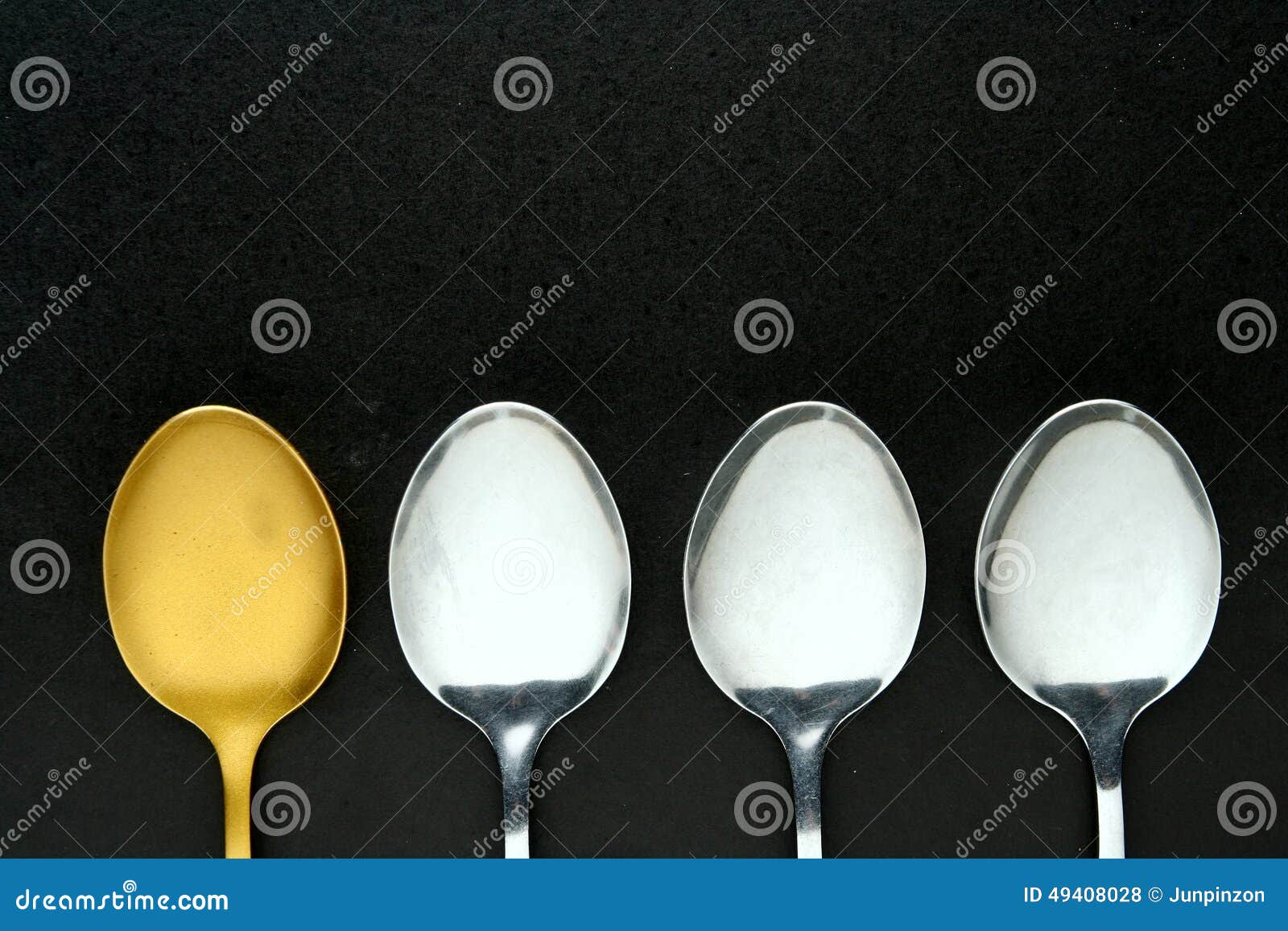Golden Spoon among Ordinary Spoons Stock Photo - Image of spoon, gold ...