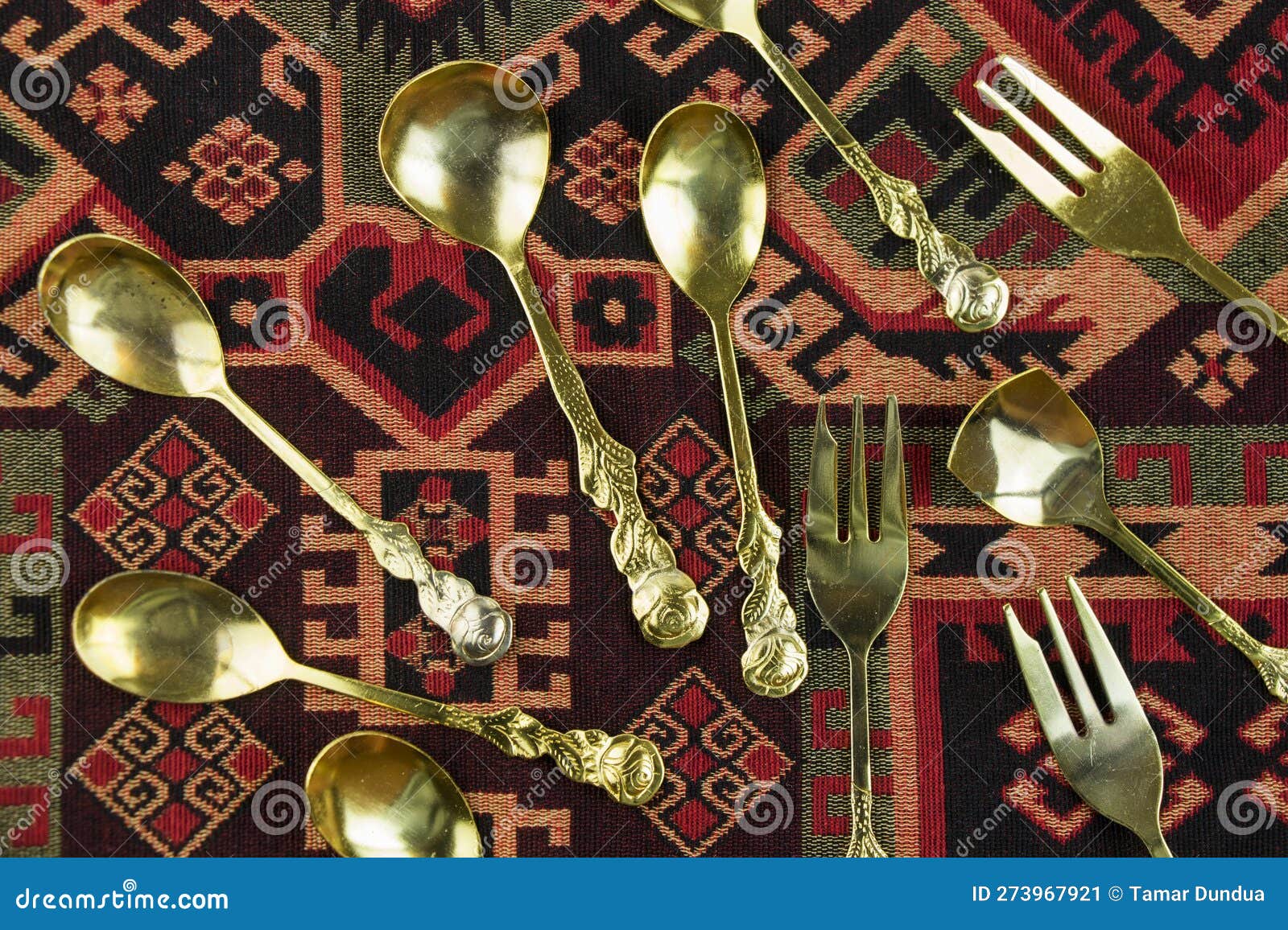 Golden spoons on the table stock image. Image of collections - 273967921