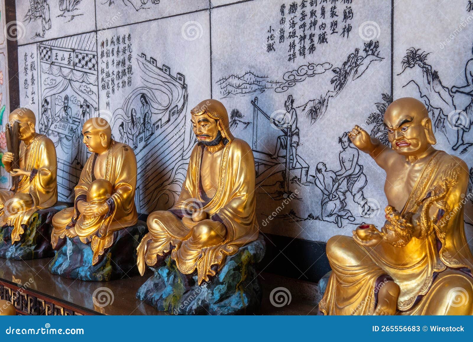 Golden Statuettes of the Korean Gods on the Table Stock Image - Image ...