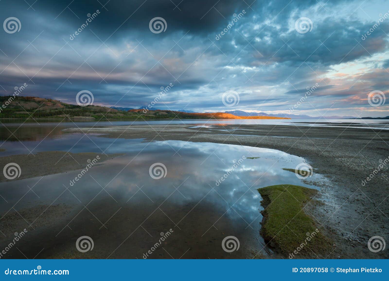 Golden Sunbeam and Dramatic Sky at Lake Laberge Stock Photo - Image of ...