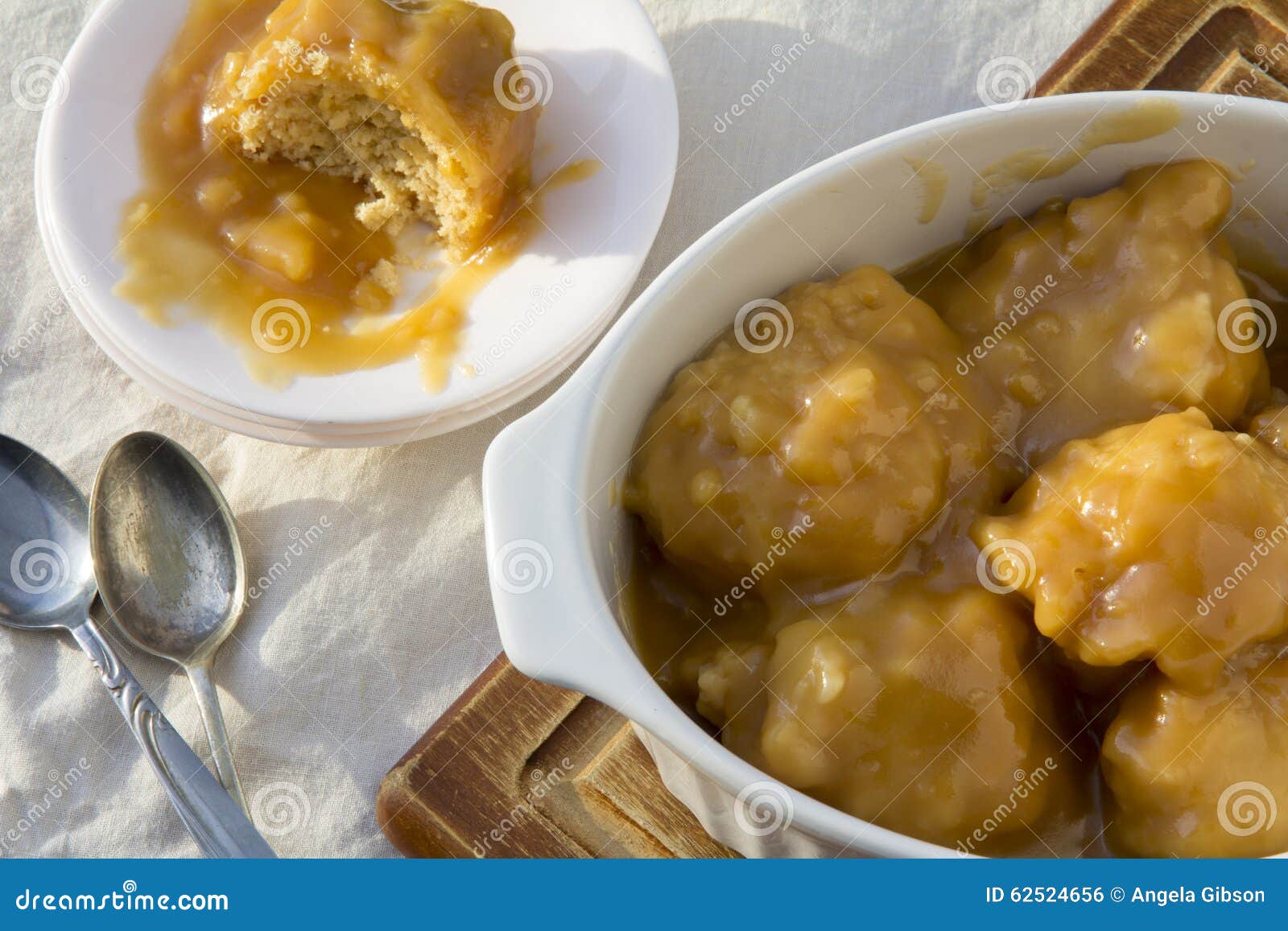 Golden Syrup Dumplings on Table with One Portion on Plate Stock Photo ...