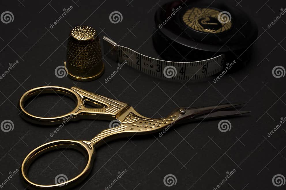 Golden tailoring utensils. stock photo. Image of composition - 65492370