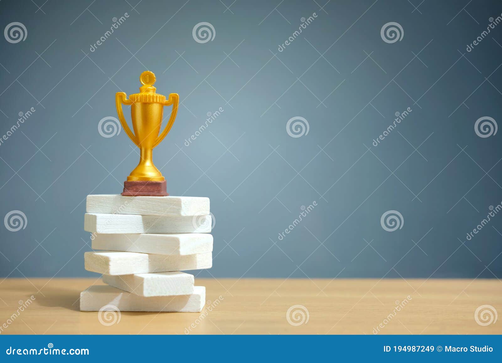 Golden Trophy Standing on White Podium Stock Image - Image of ...
