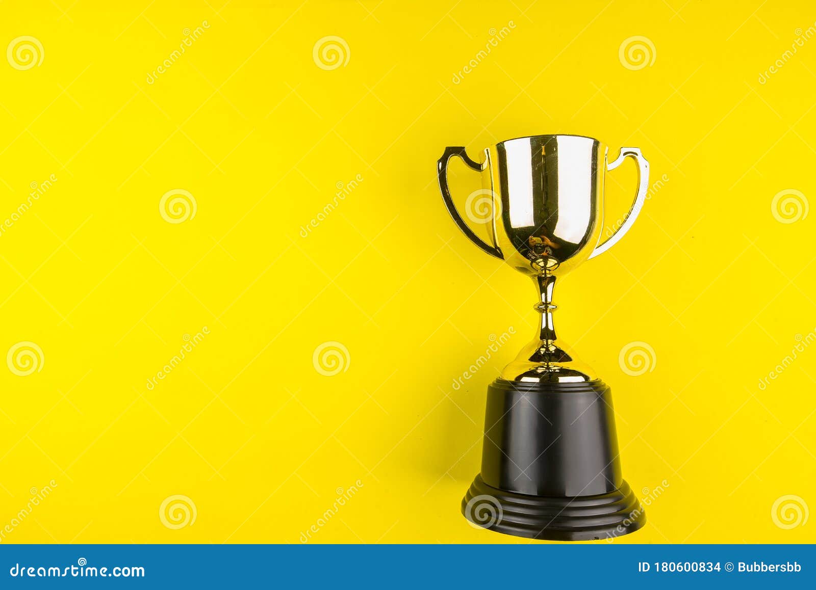Golden Trophy on Yellow Background.Concept Championship Stock Photo ...