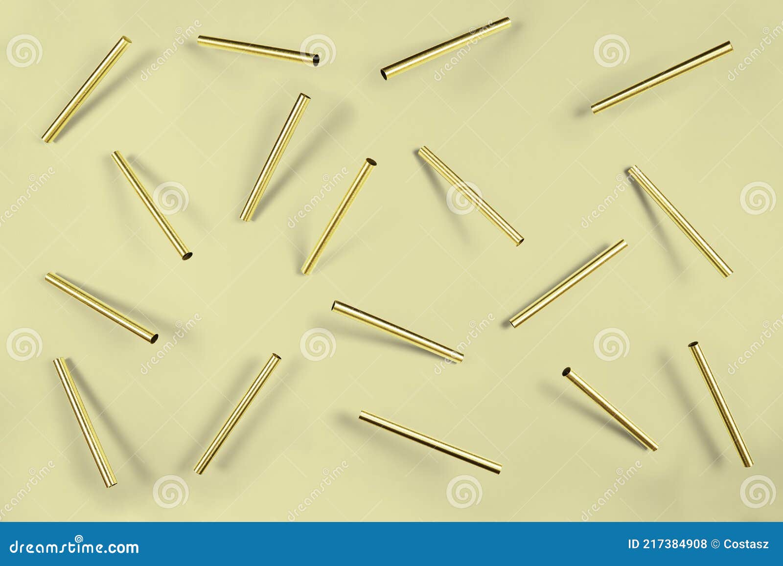 Golden tubes falling stock photo. Image of shine, moment - 217384908