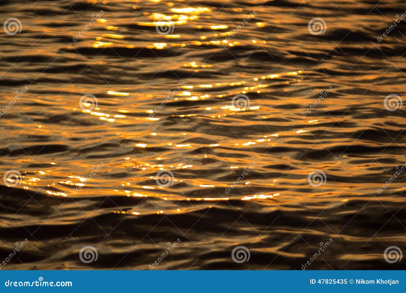 Golden water waves stock image. Image of ripple, light - 47825435