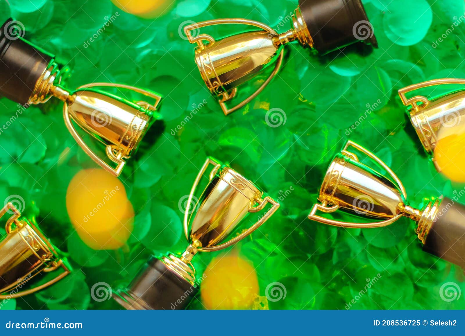 Golden Winner Cups on a Green Background. Competitions Concept Stock ...