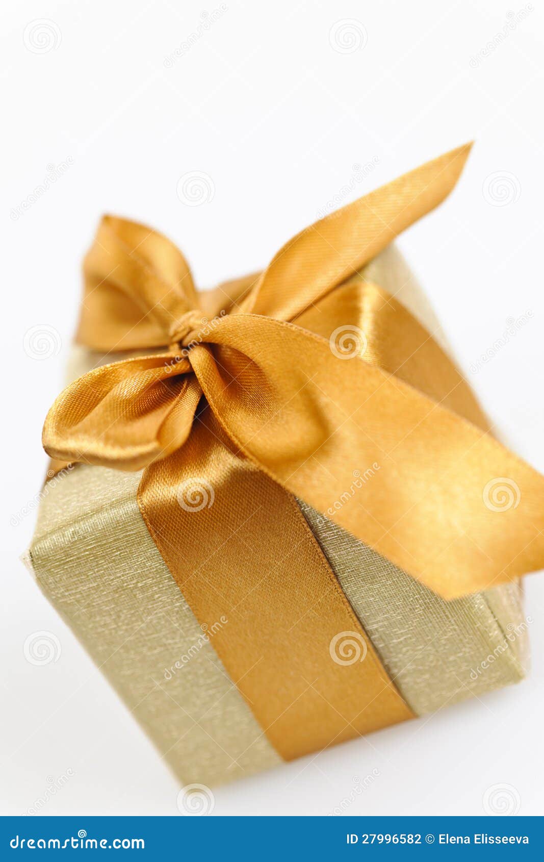 Golden wrapped gift box stock photo. Image of give, presents - 27996582