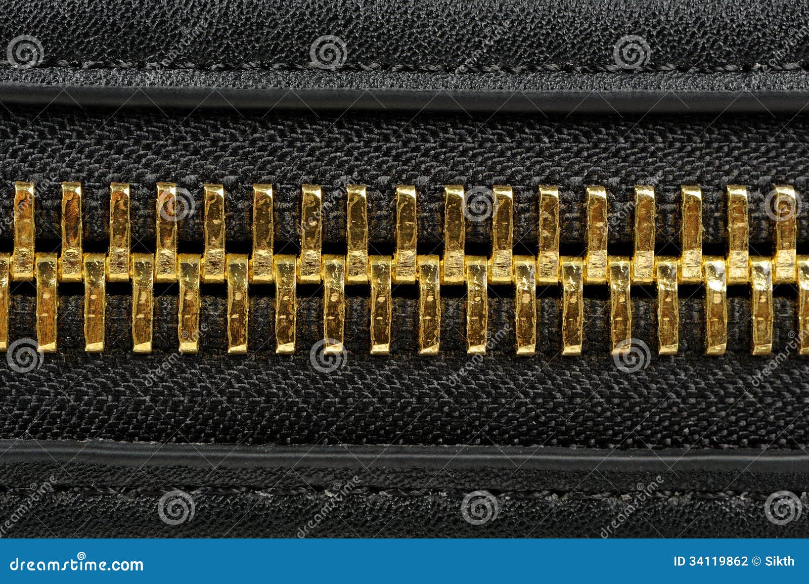 Golden Zipper Close-Up stock photo. Image of cloth, golden - 34119862