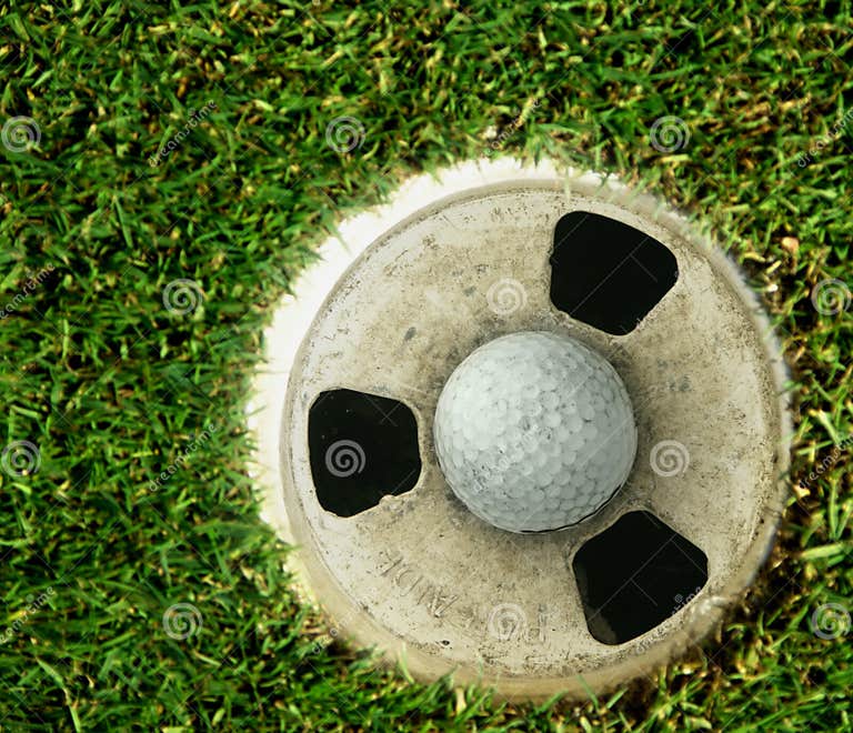 Golf Ball in Cup on Green stock photo. Image of golf, hole - 3558338