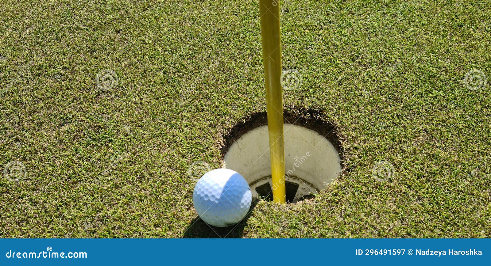 Golf Ball in the Hole on the Golf Course Stock Image - Image of golfing ...