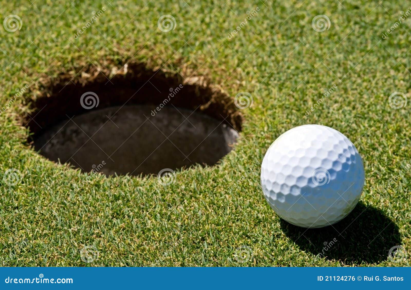 Golf ball next to a hole stock photo. Image of summer - 21124276