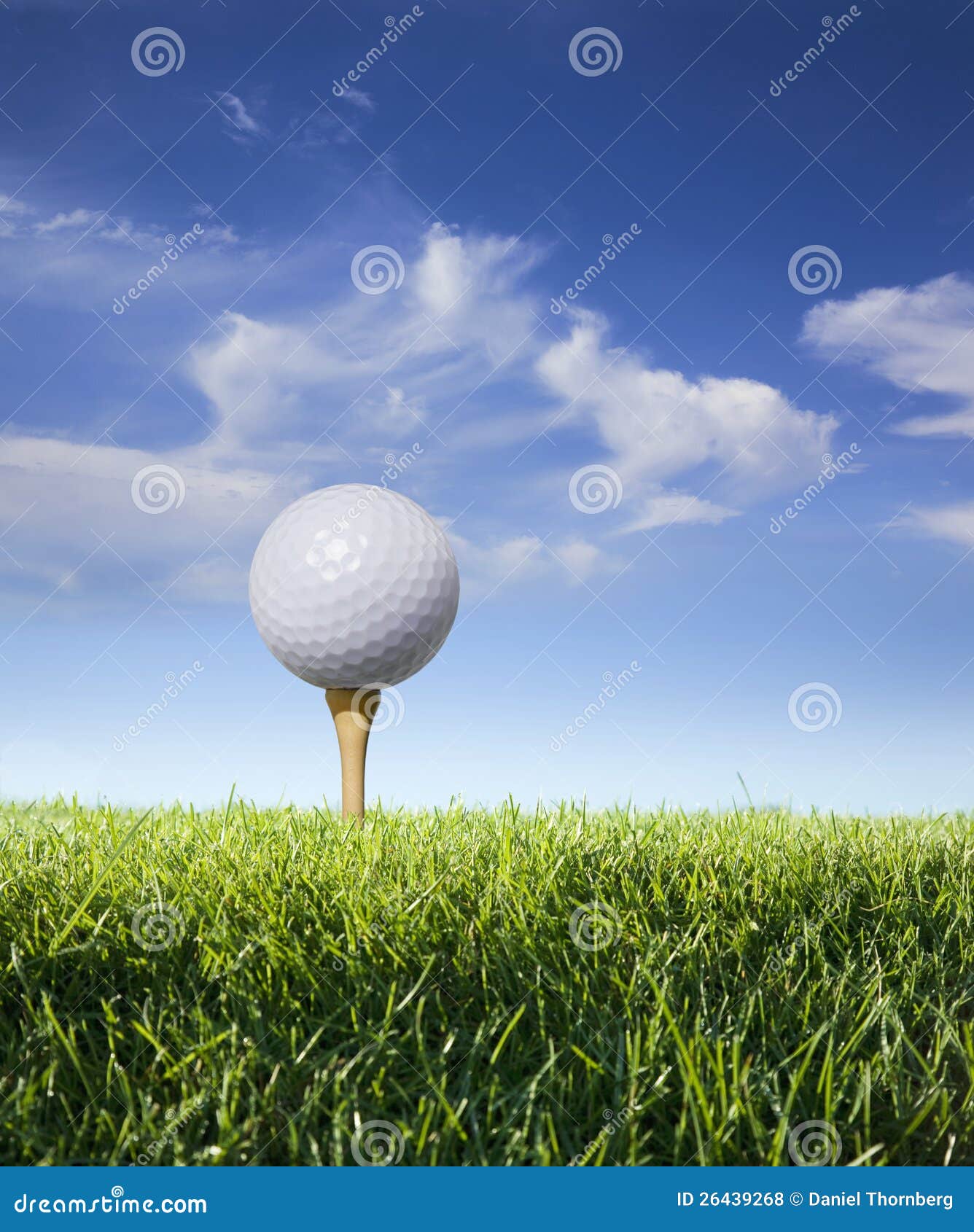 Golf Ball on Tee with Grass, Blue Sky and Clouds Stock Photo - Image of ...