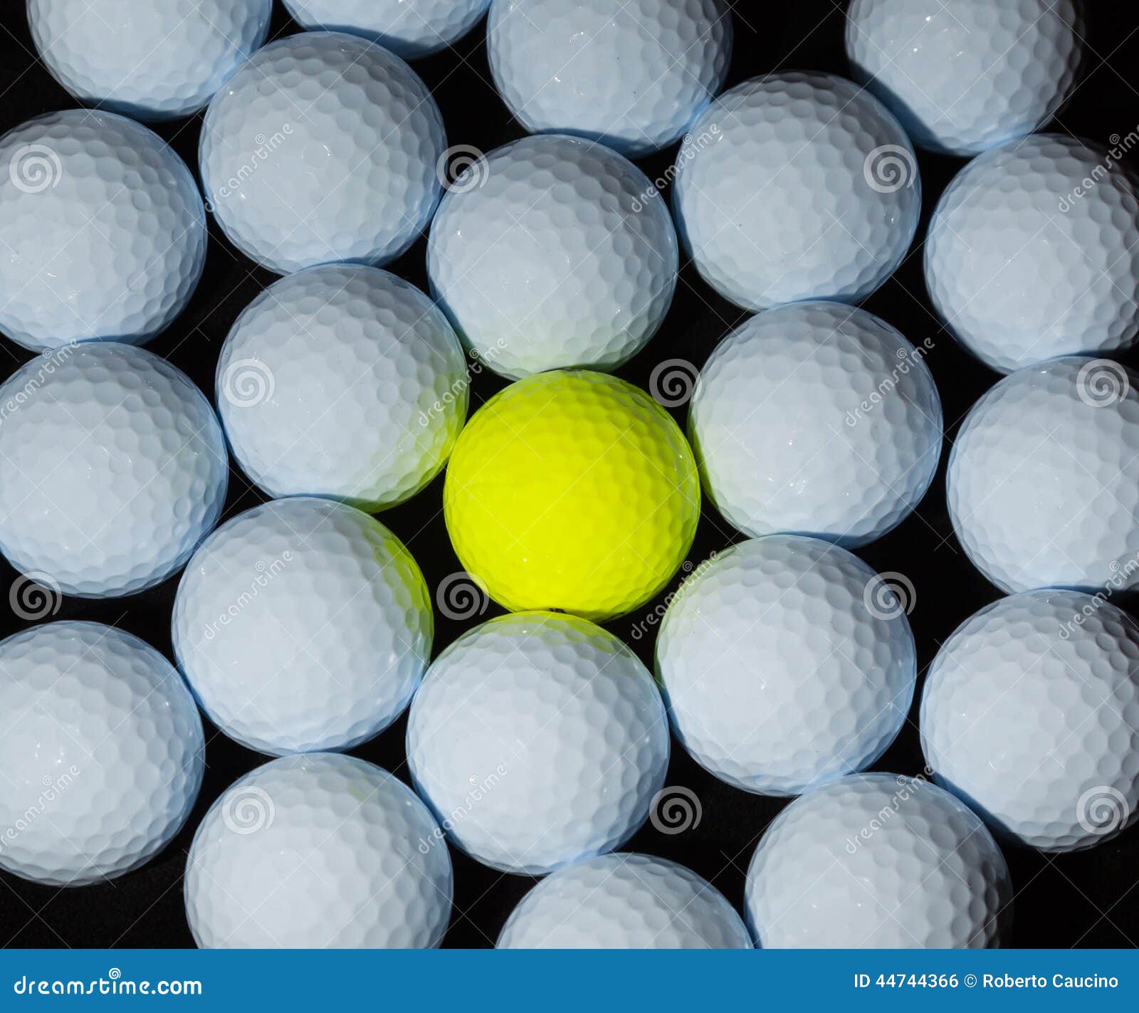 Golf Balls. Single Yellow Ball Mixed within Many White Balls Stock ...