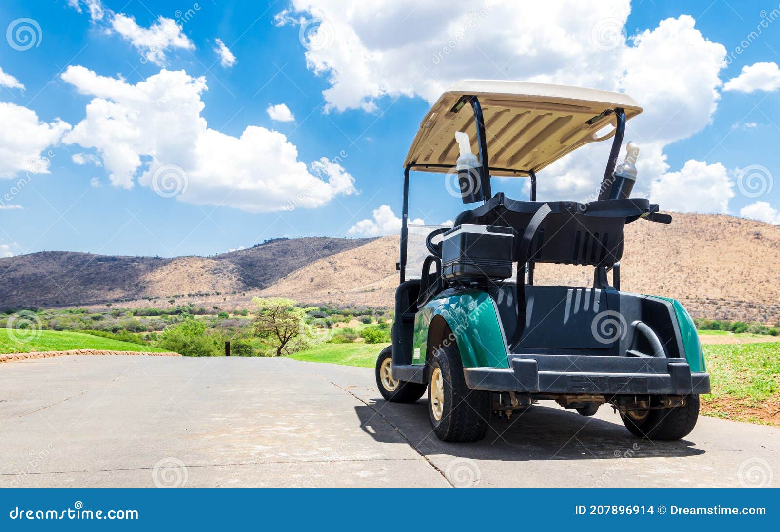 Golf cart on a golf course stock photo. Image of clouds - 207896914