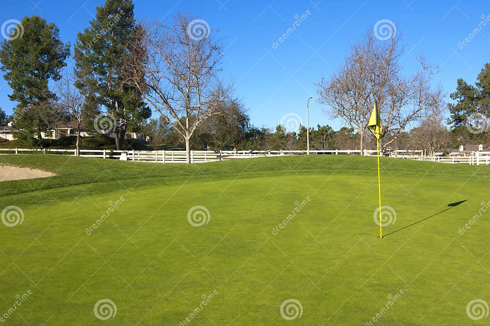 Golf Course with Green Grass, Trees and Fence Stock Photo - Image of ...