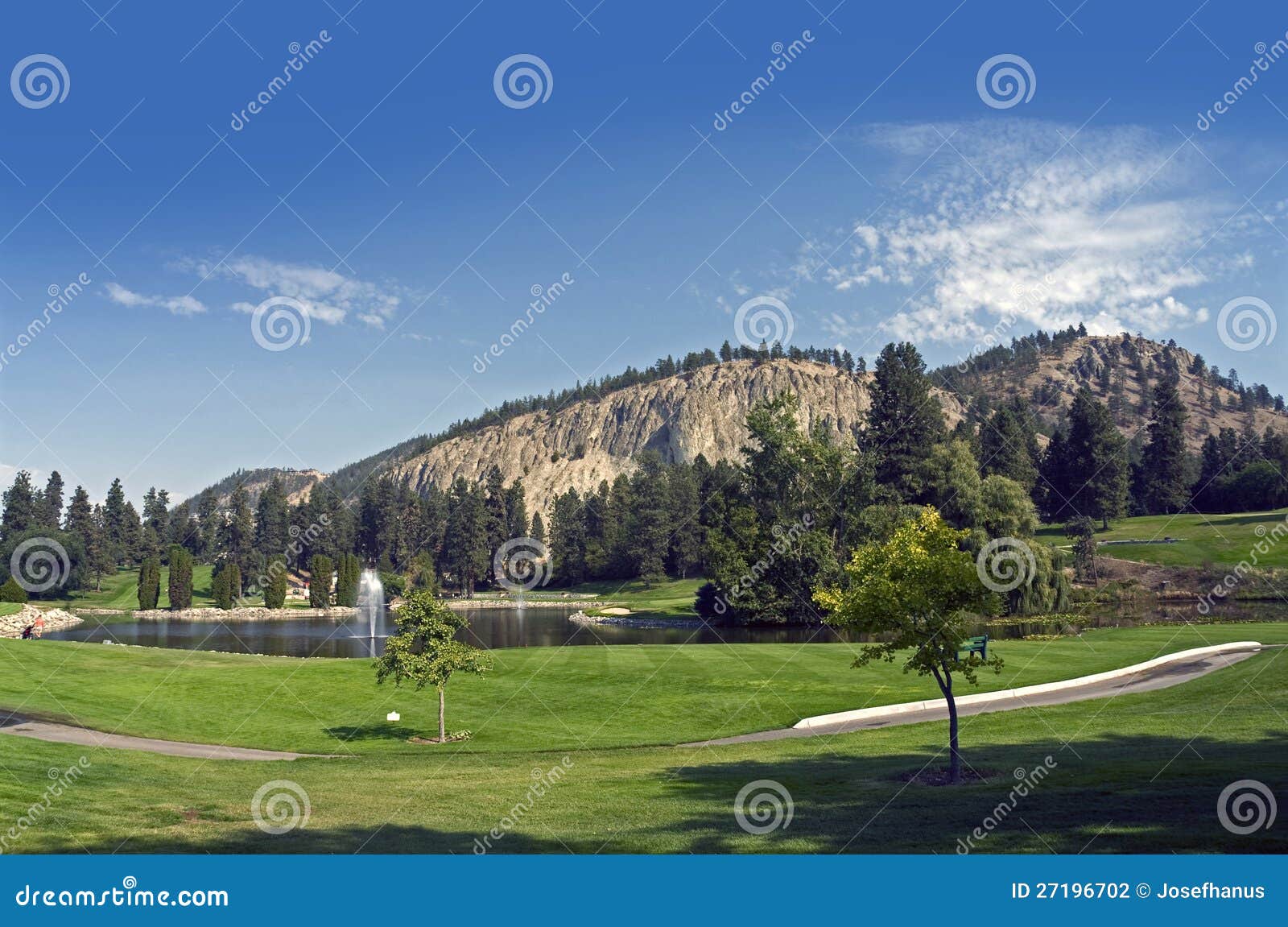Golf Course by mountains stock photo. Image of canada - 27196702