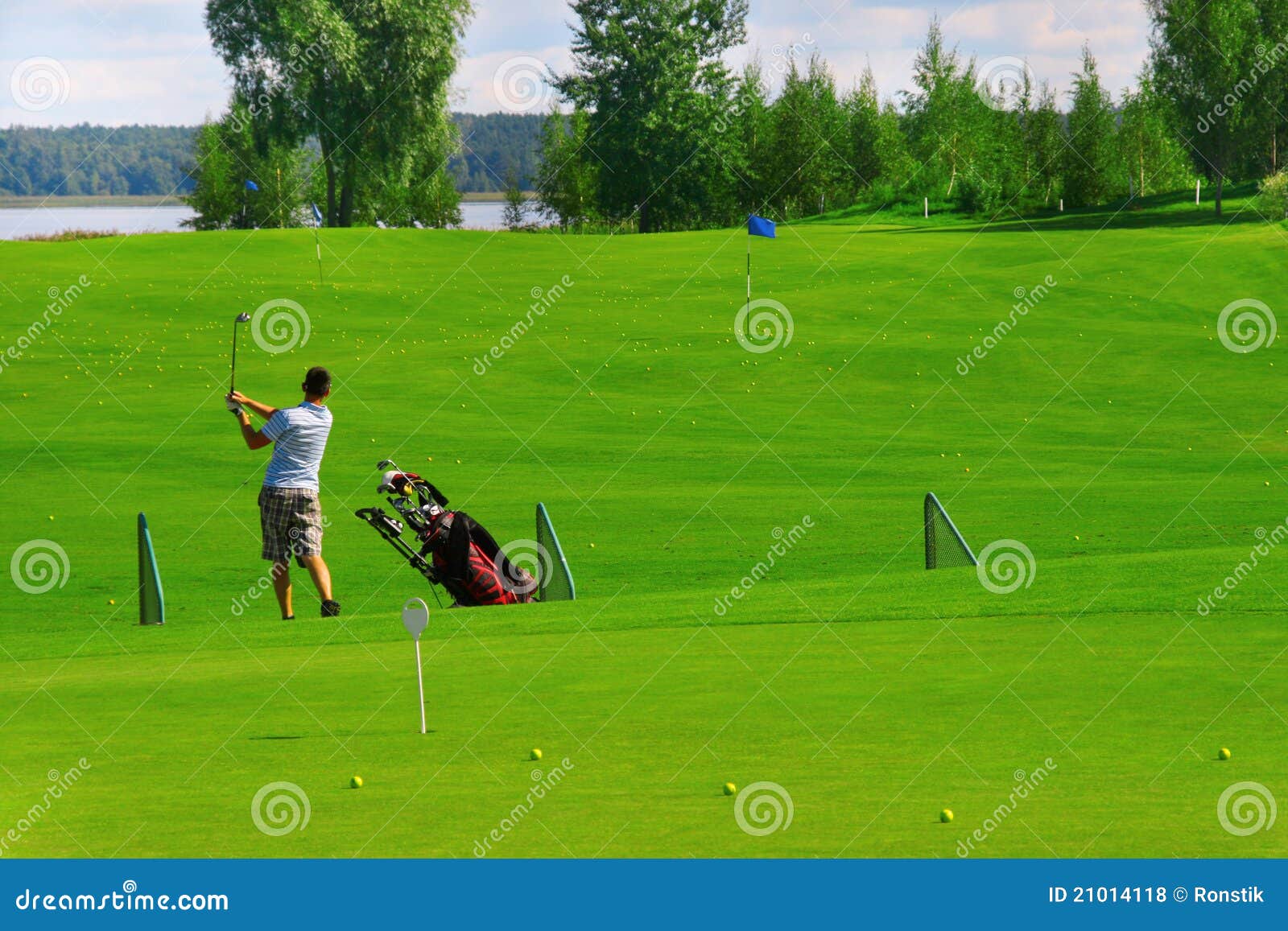 Golf course with player stock photo. Image of lawn, land - 21014118