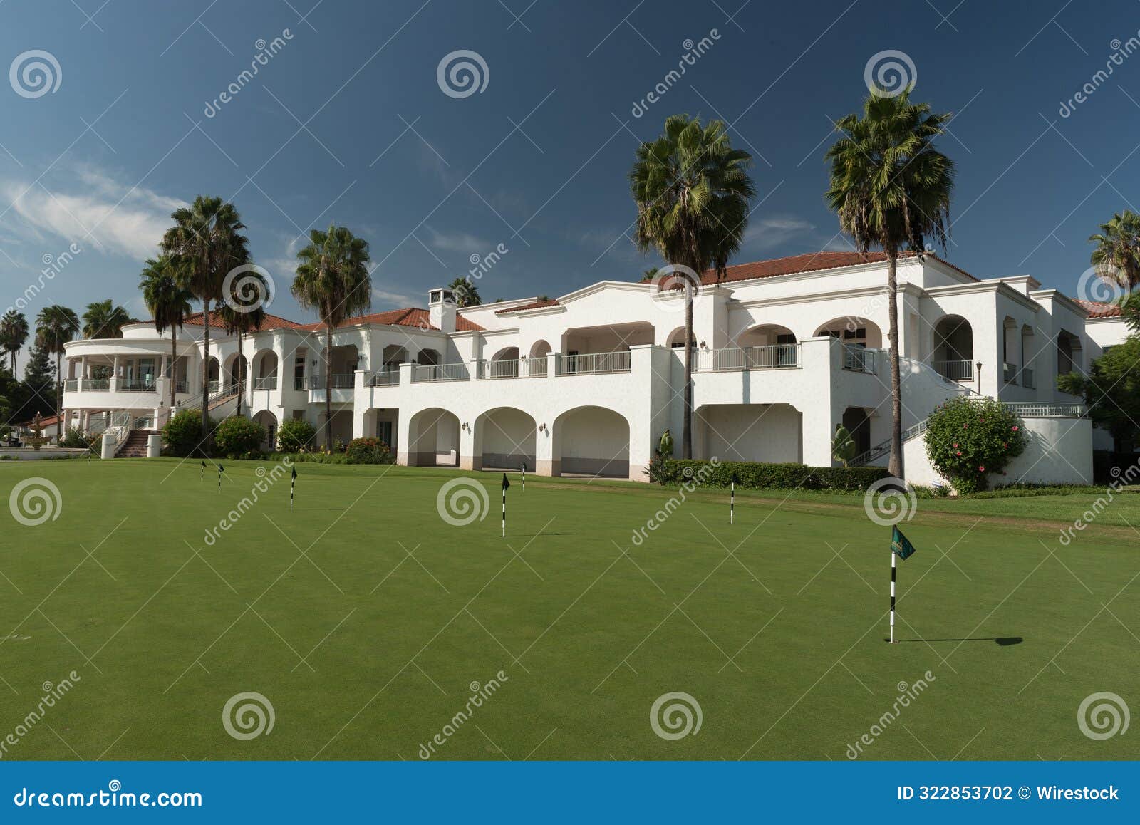 Golf Course at a Resort with Palm Trees Flanking the Building Stock ...