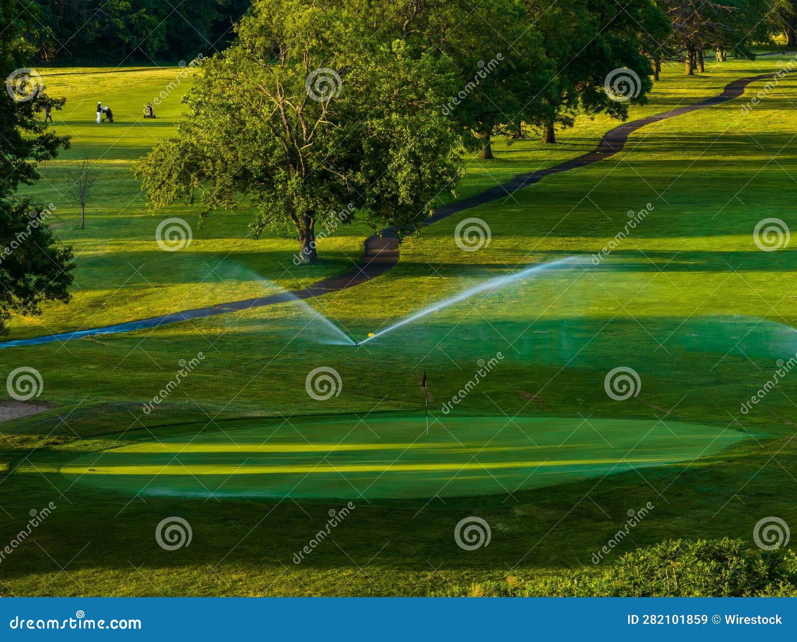 Golf Course with a Sprinkler Stock Image - Image of hydrating, water ...