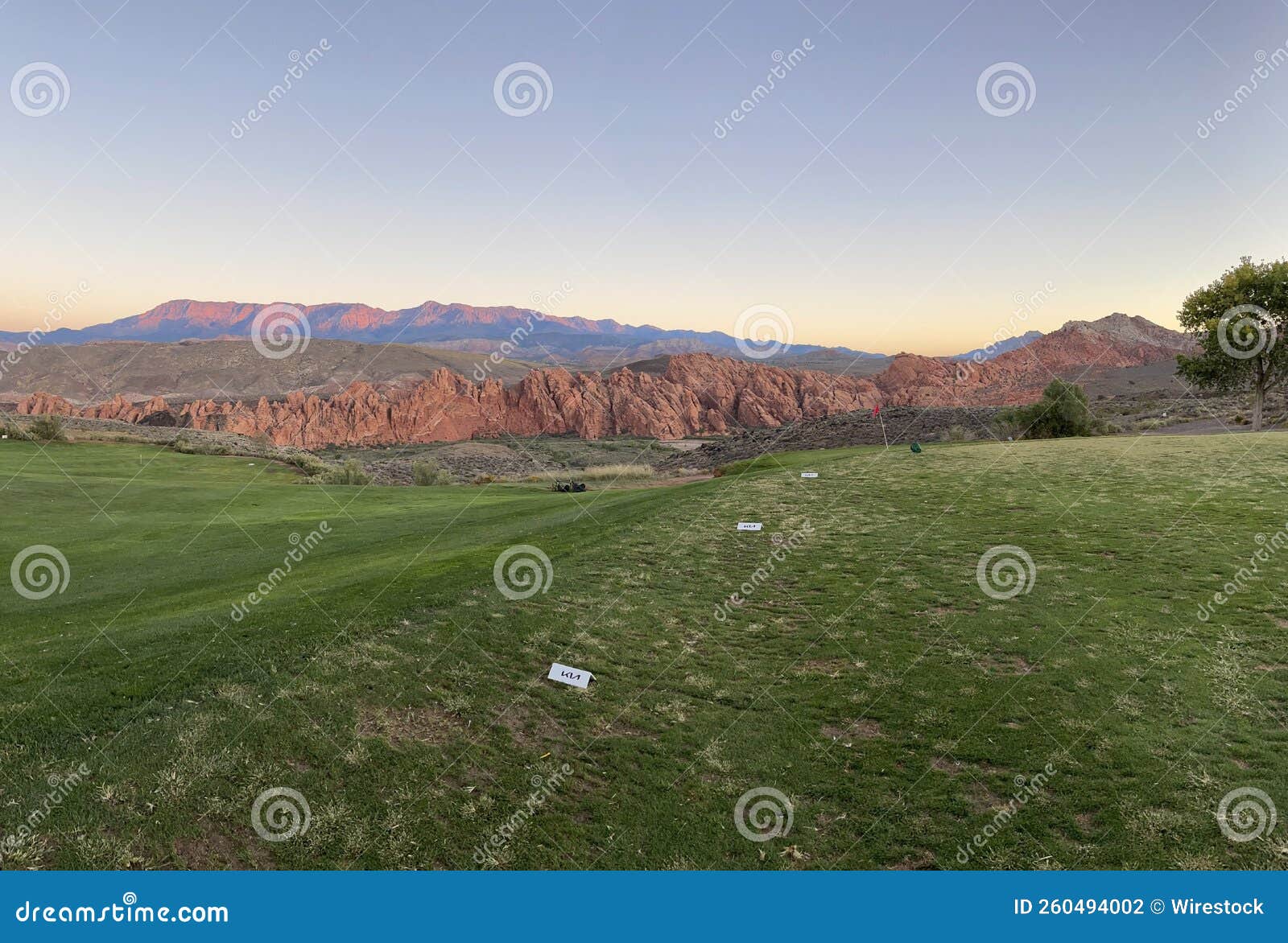 Golf Course at Sunset with Hills and Mountains on the Background Stock ...
