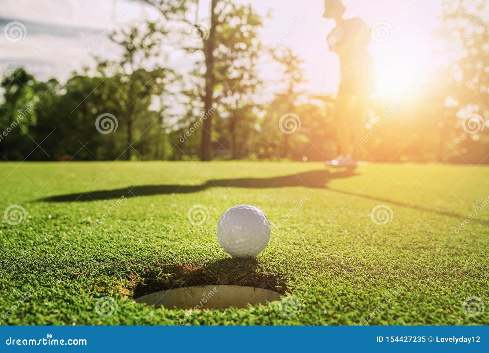 Golf Player Putting Golf Ball into Hole Stock Image - Image of ball ...