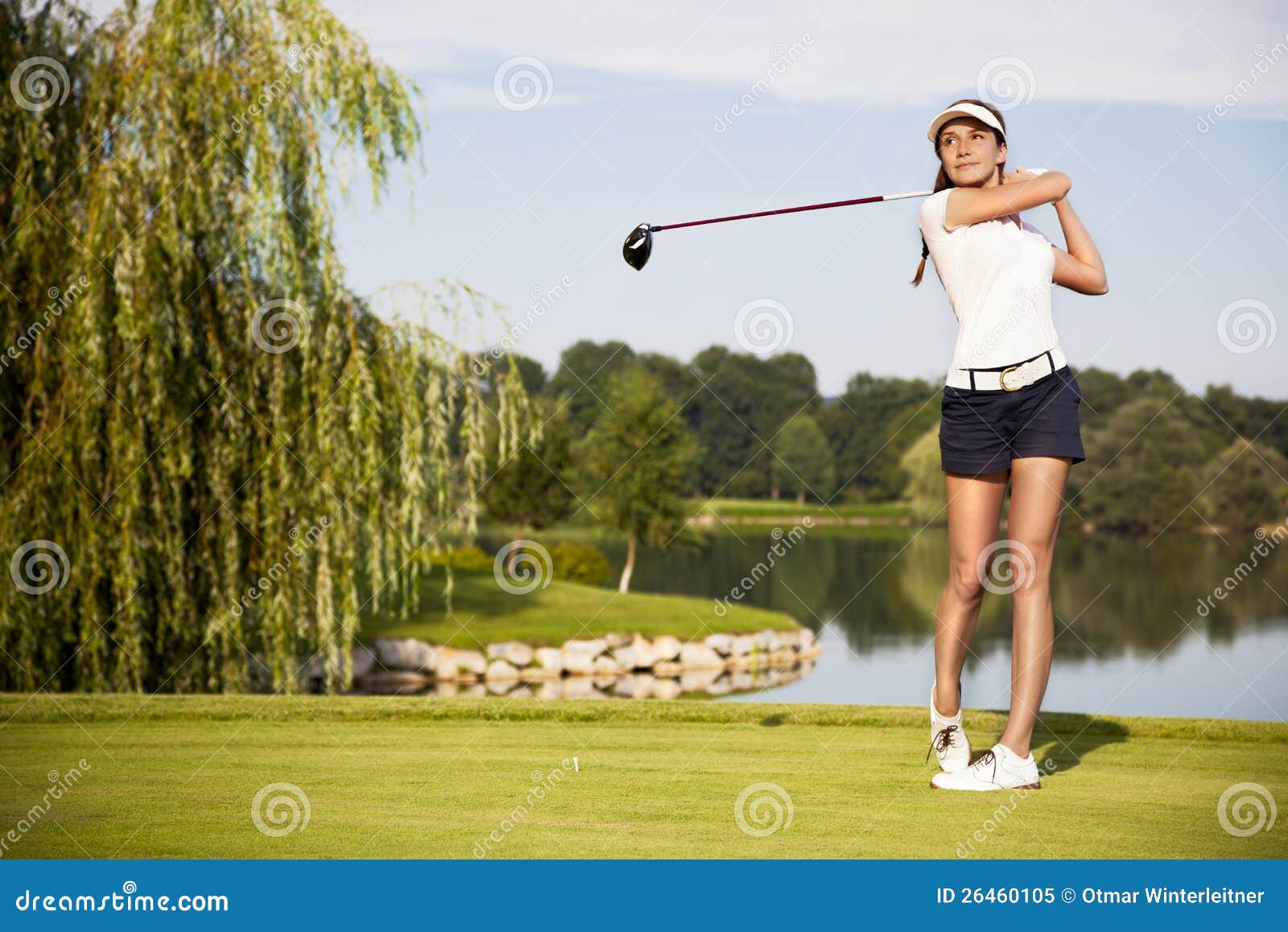 Golf player teeing off stock image. Image of stroke, landscape - 26460105