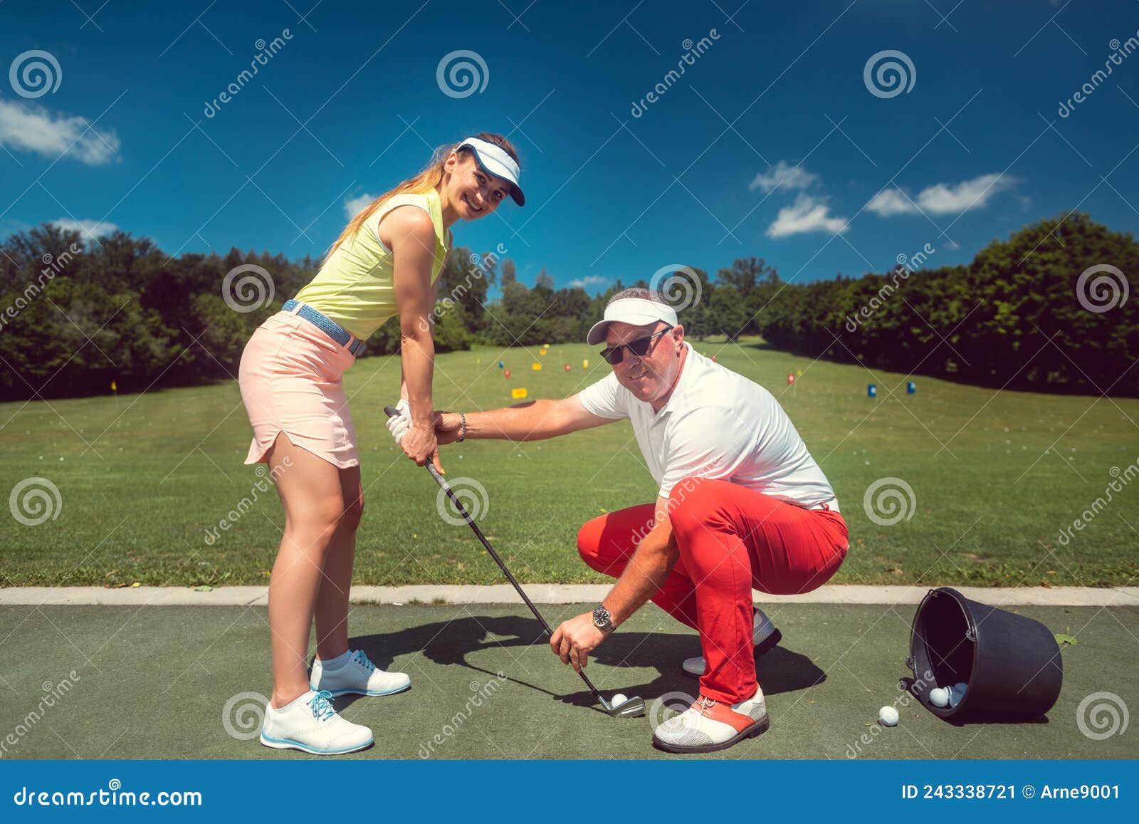 Golf Pro Teaching a Woman Student of the Driving Range Stock Image ...