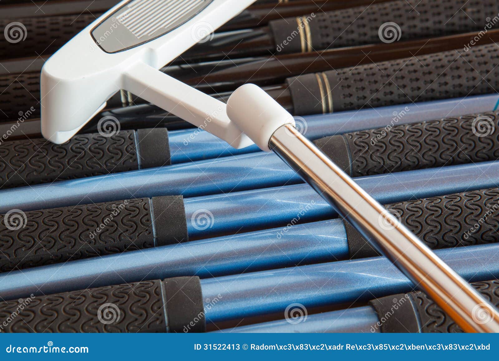 Golf putter and golf clubs stock image. Image of field - 31522413