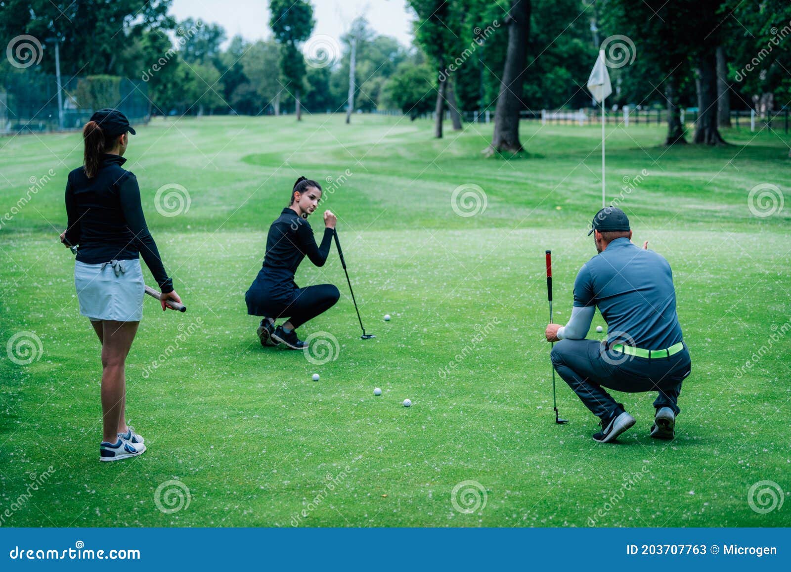Golf Putting. Two Young Ladies Practicing Putting Stock Image - Image ...