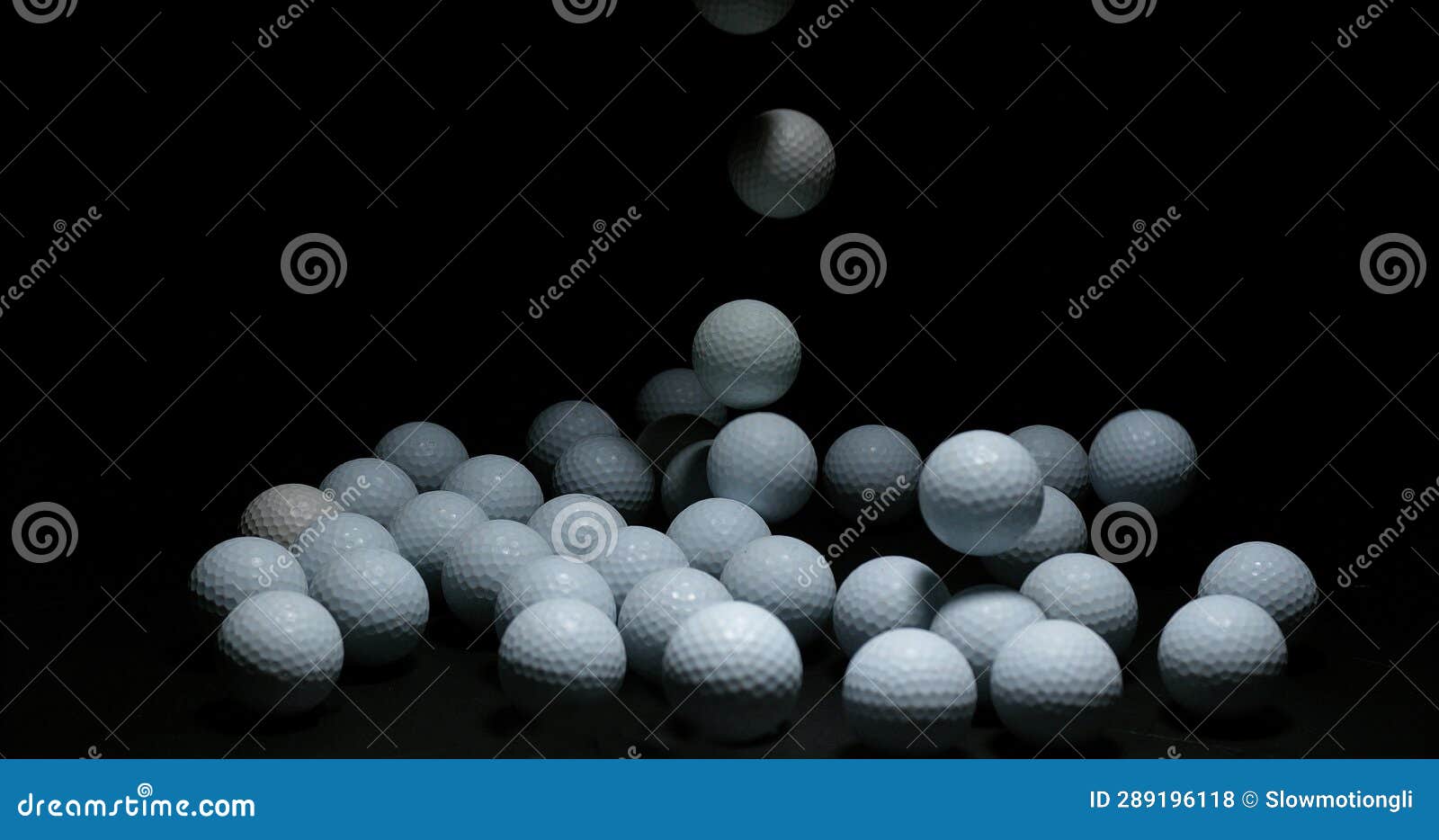 Golf S Balls Falling Against Black Background Stock Photo - Image of ...